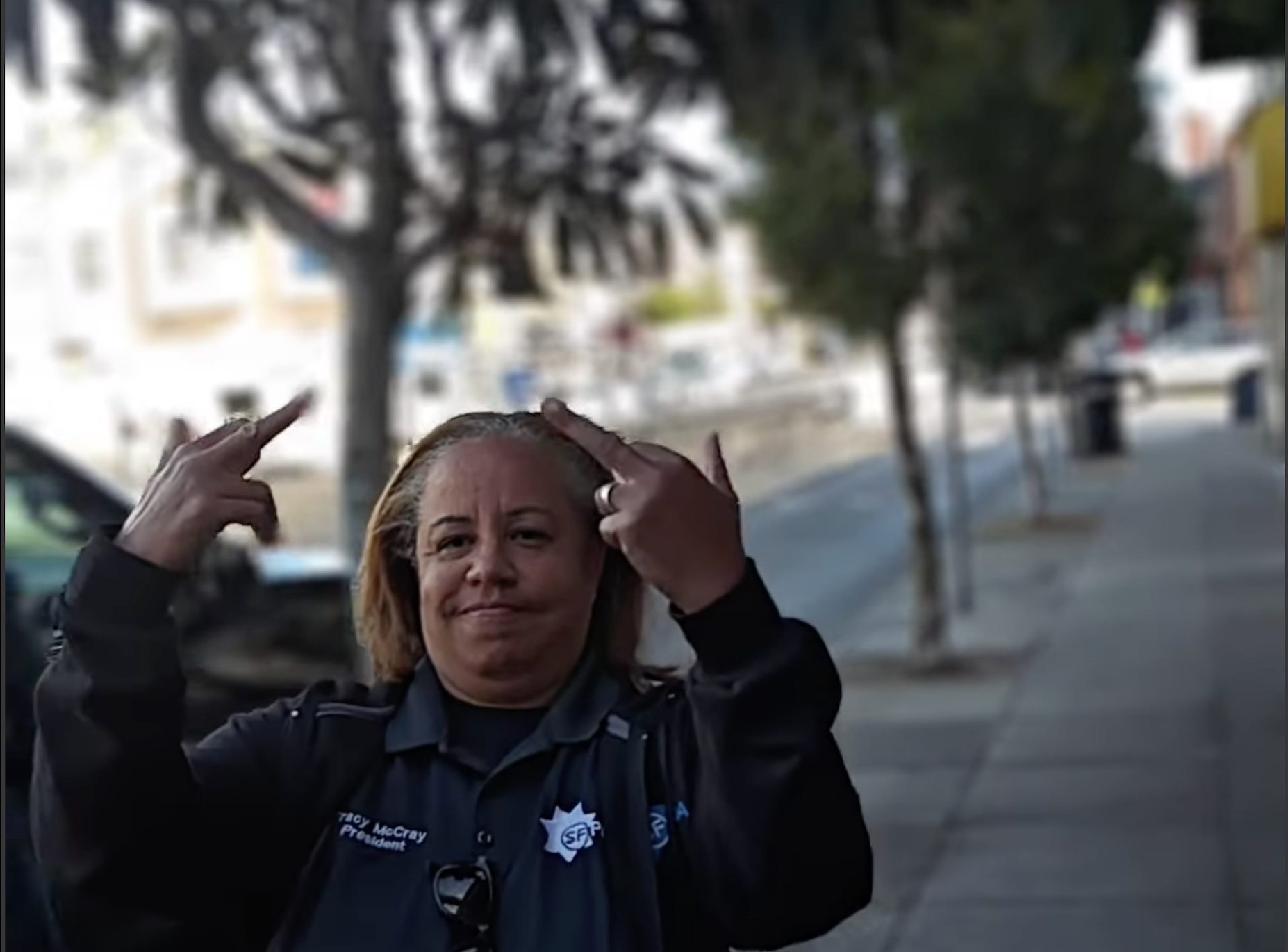 S.F. police union head flips off activist in heated exchange
