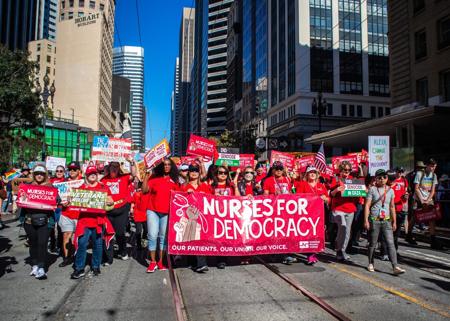 Defiance and solidarity fill the streets as thousands protest Trump